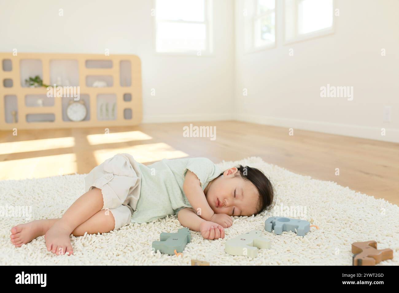 A girl taking a nap in the living room Stock Photo - Alamy