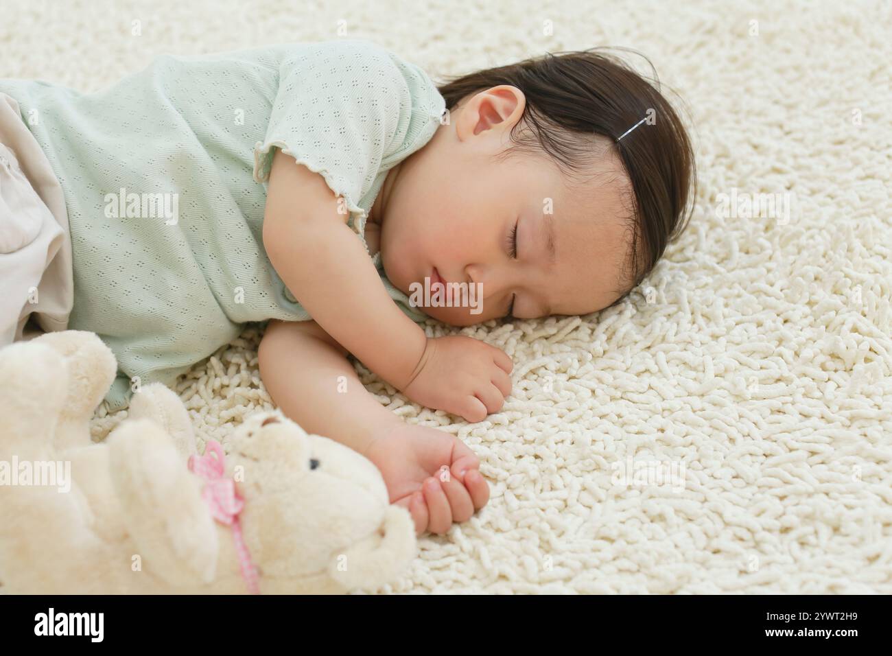 A girl taking a nap in the living room Stock Photo - Alamy