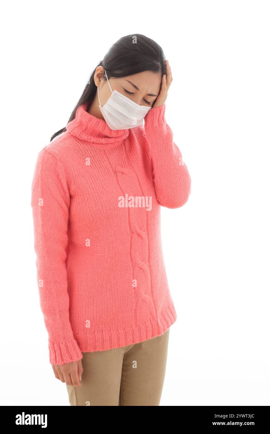 Unwell woman wearing a mask Stock Photo - Alamy