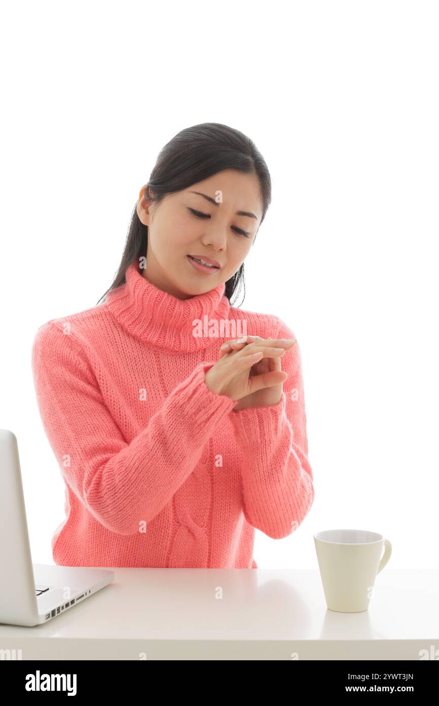 Woman staring at rough hand Stock Photo - Alamy