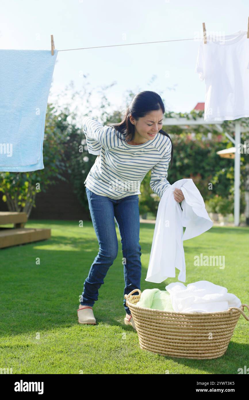 Woman in garden injury hi-res stock photography and images - Alamy