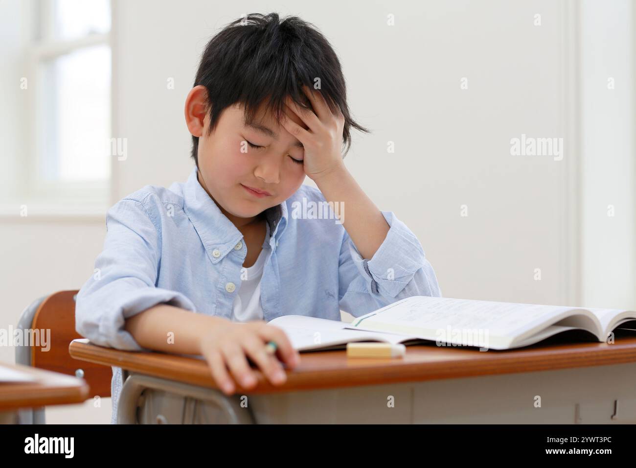Primary school student who gets sick during class Stock Photo - Alamy