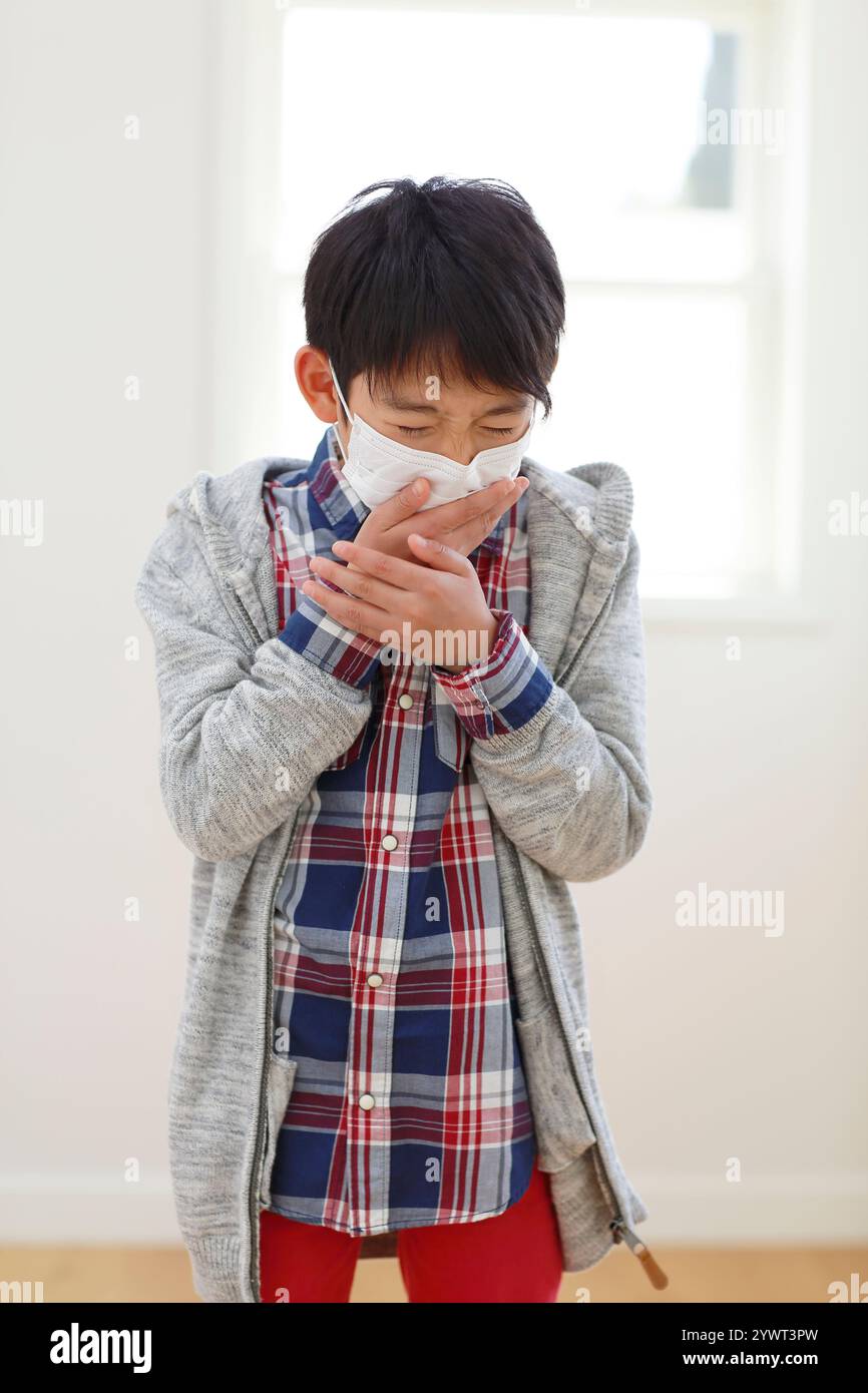 Schoolchildren coughing with masks Stock Photo - Alamy