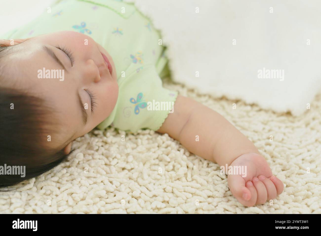 Baby taking a nap Stock Photo - Alamy