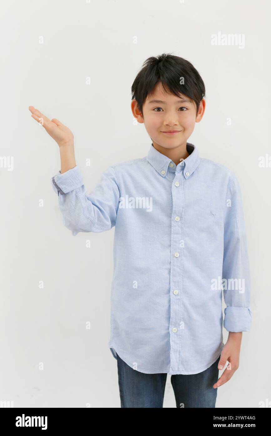 Posed boy leading the way Stock Photo - Alamy