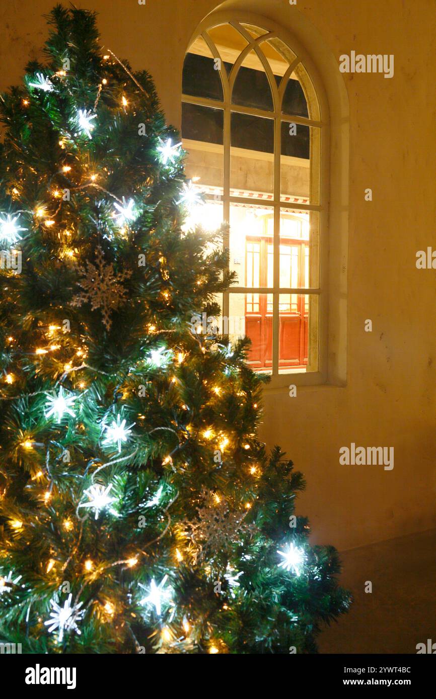 Street view from window of room with Christmas tree Stock Photo - Alamy