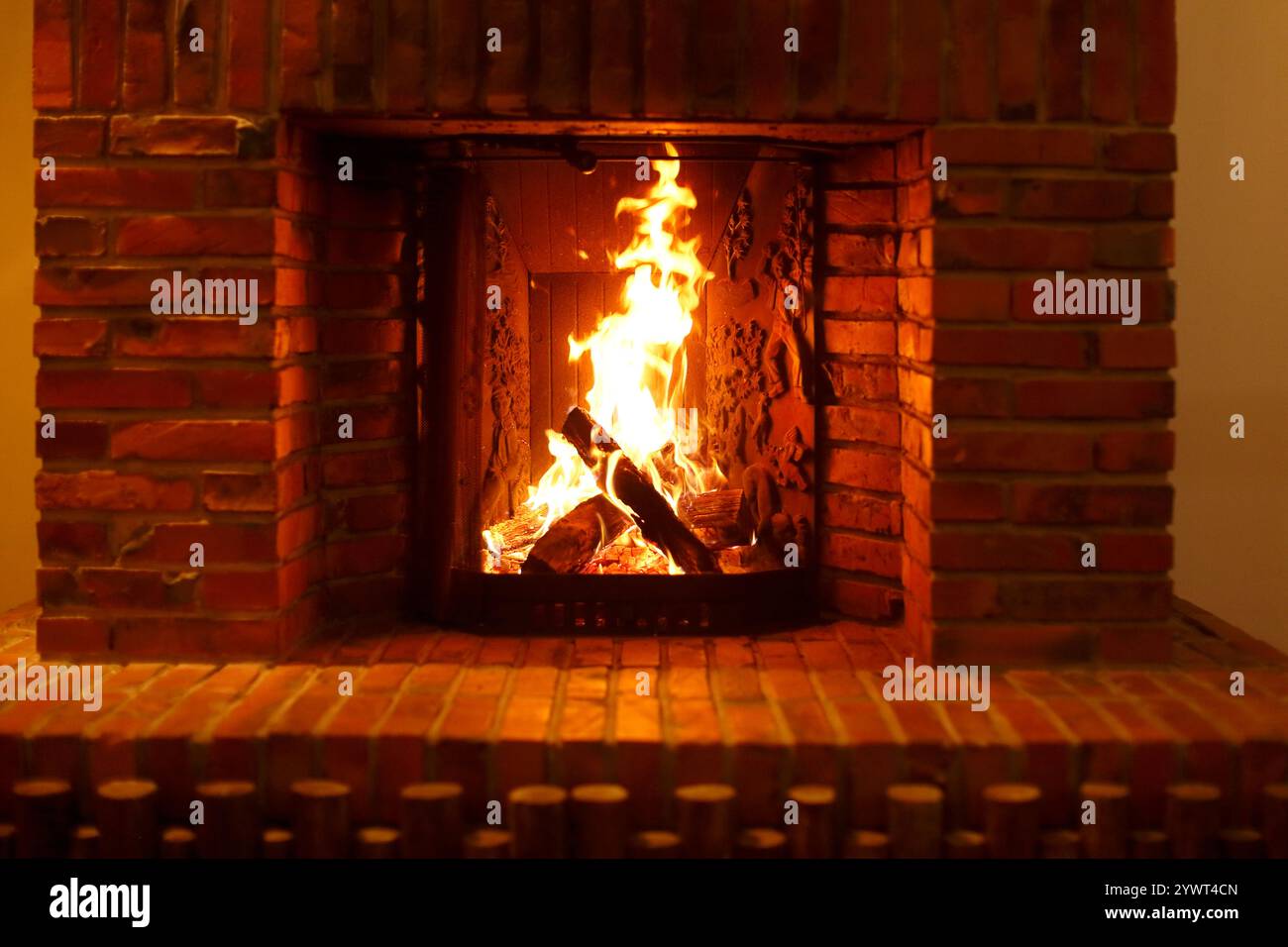 Fireplace with flames burning Stock Photo - Alamy