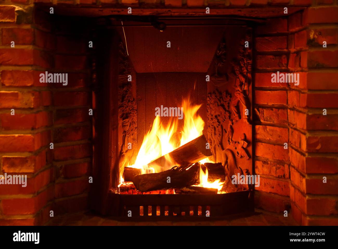 Fireplace with flames burning Stock Photo - Alamy
