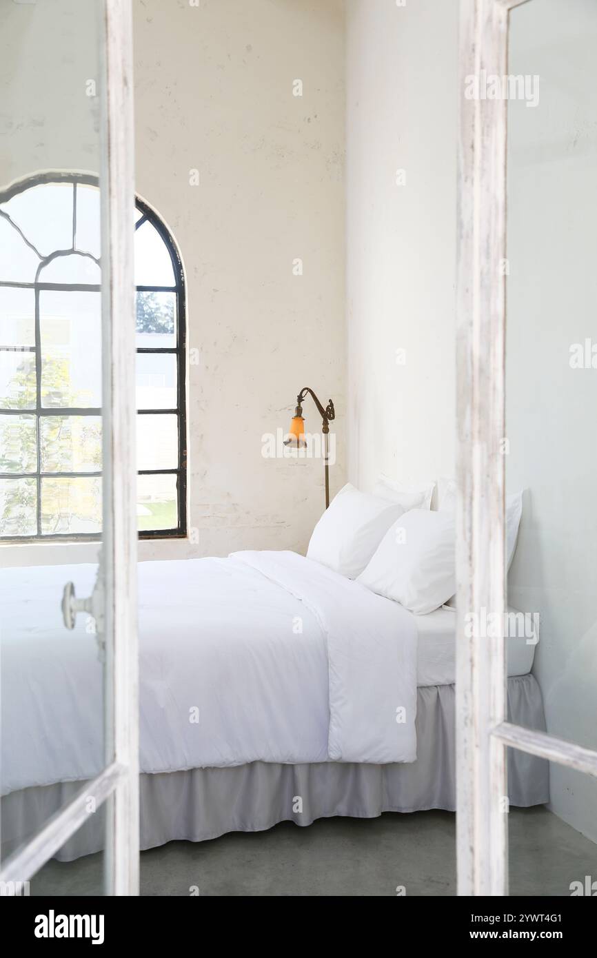 Large bedroom peeking through window Stock Photo - Alamy