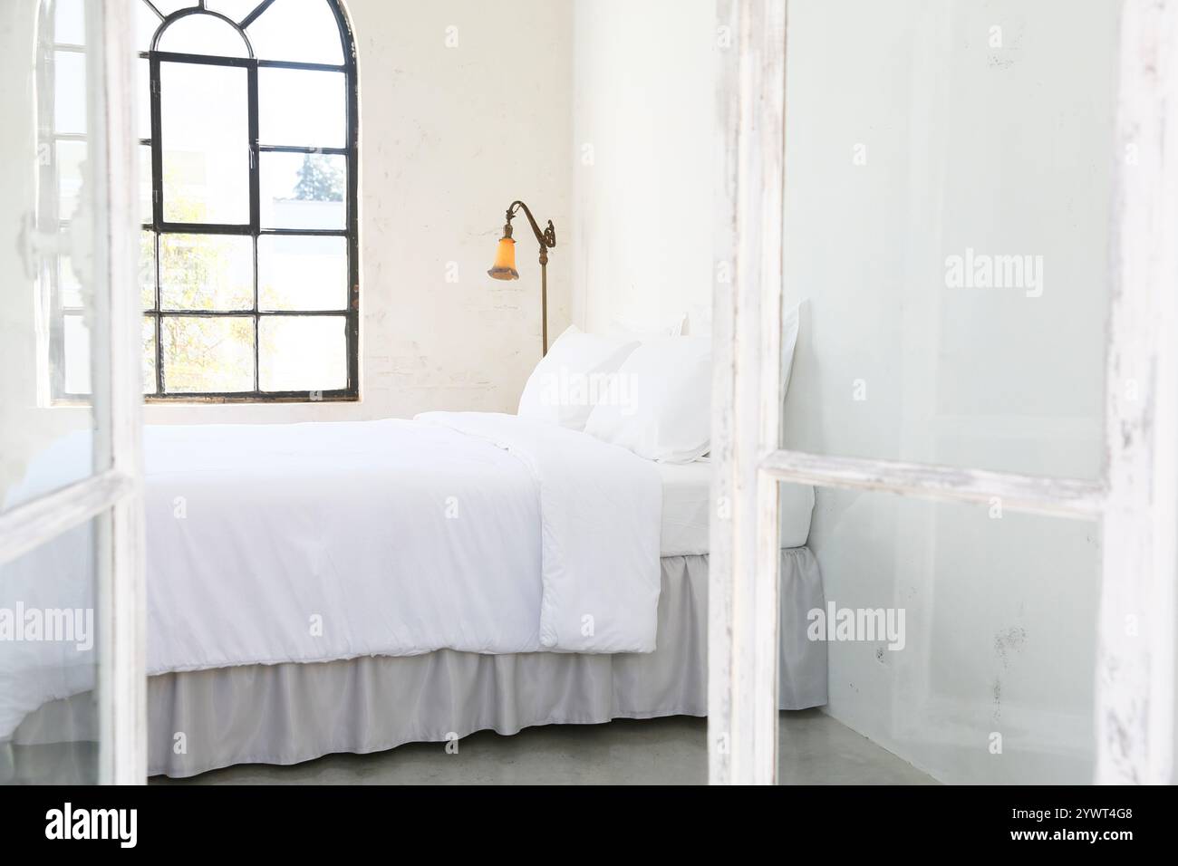 Large bedroom peeking through window Stock Photo - Alamy