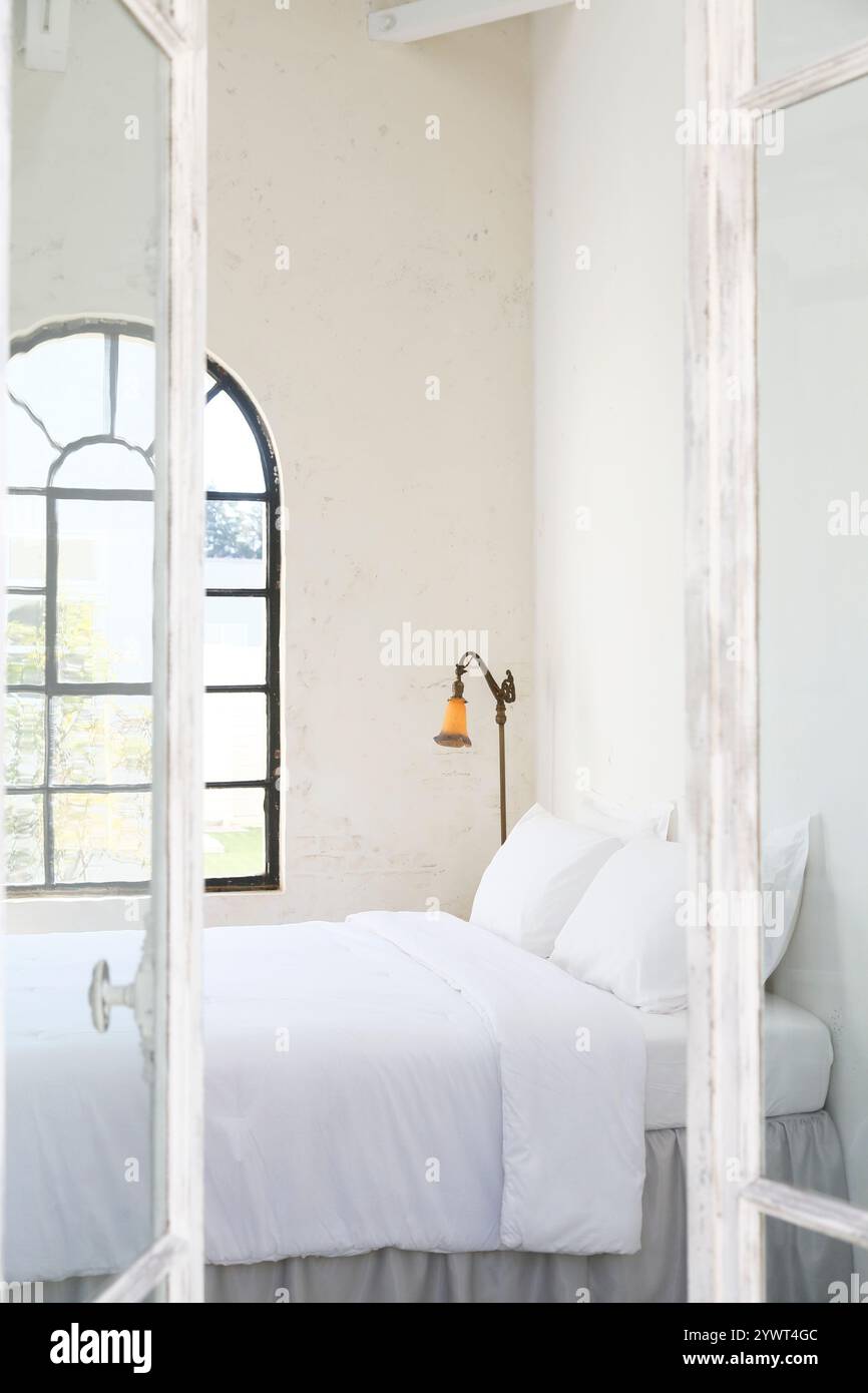 Large bedroom peeking through window Stock Photo - Alamy