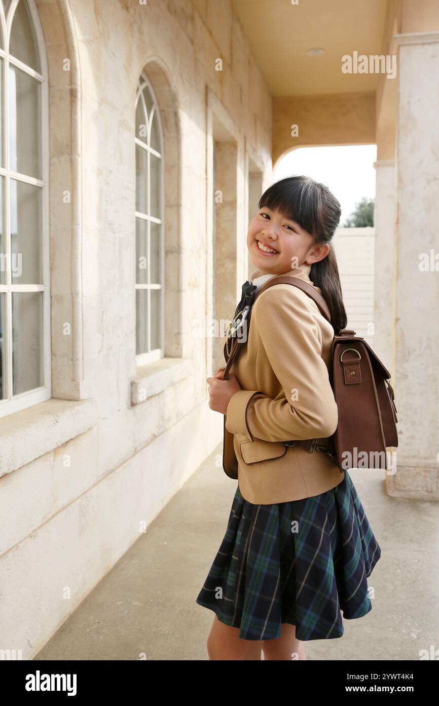 School building and girl in uniform Stock Photo - Alamy