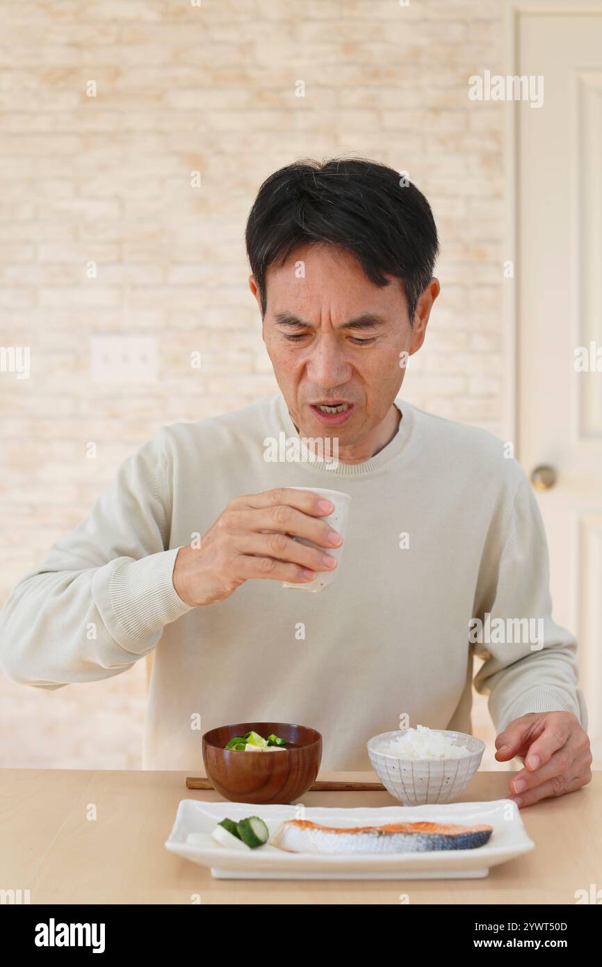 Middle-aged man who feels uncomfortable with his sense of taste Stock ...