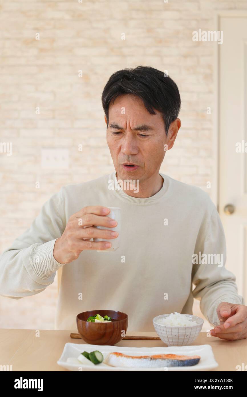 Middle-aged man who feels uncomfortable with his sense of taste Stock ...