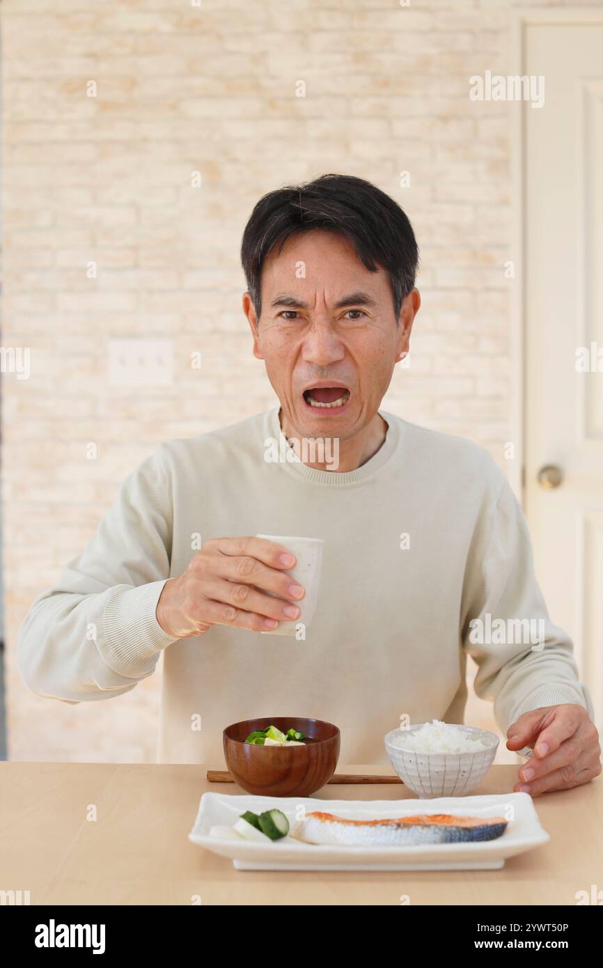 Middle-aged man who feels uncomfortable with his sense of taste Stock ...