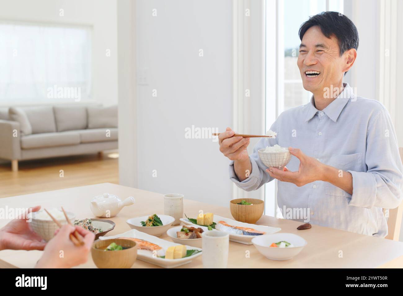 Middle-aged man eating breakfast Stock Photo - Alamy