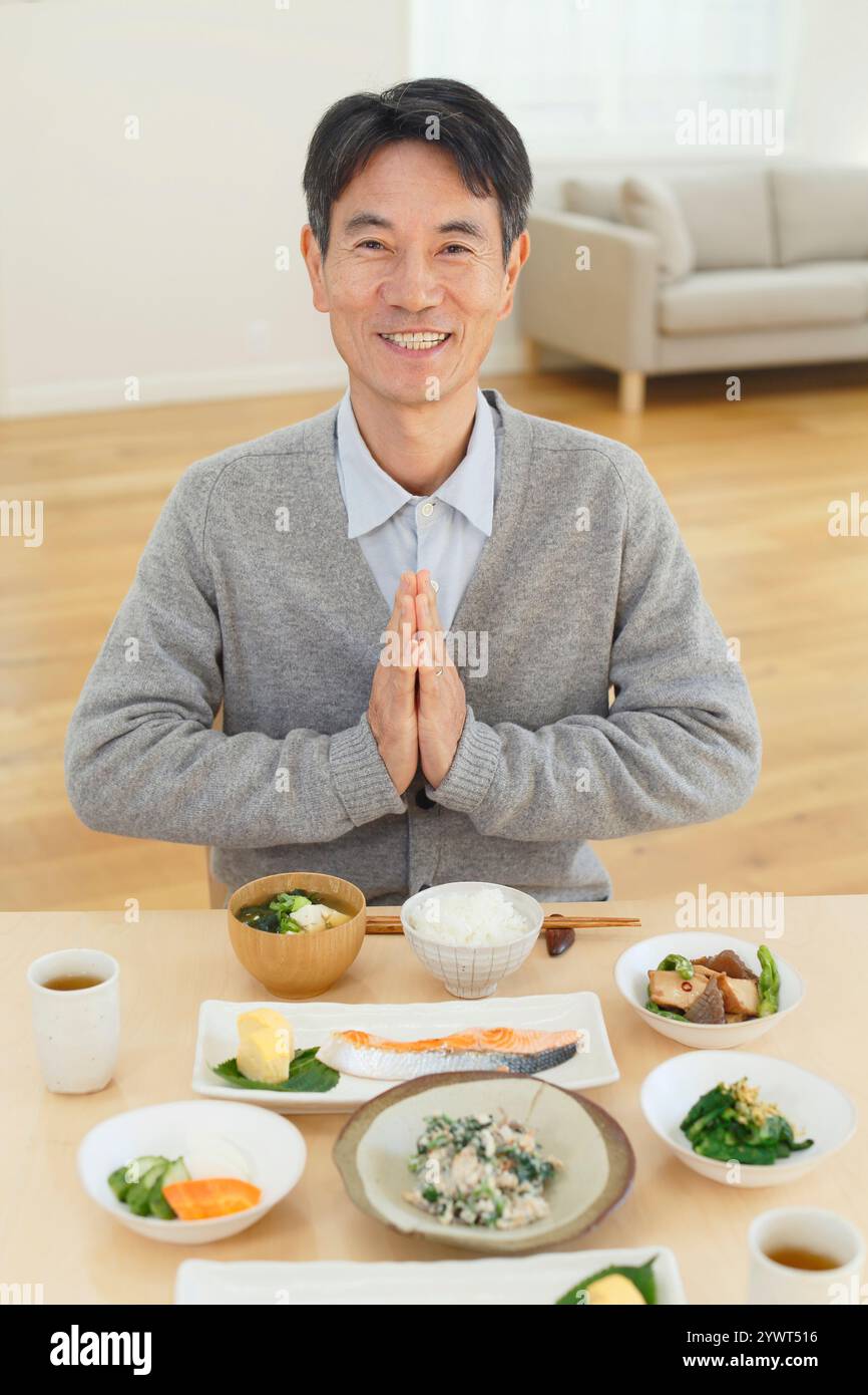 Middle-aged man eating breakfast Stock Photo - Alamy