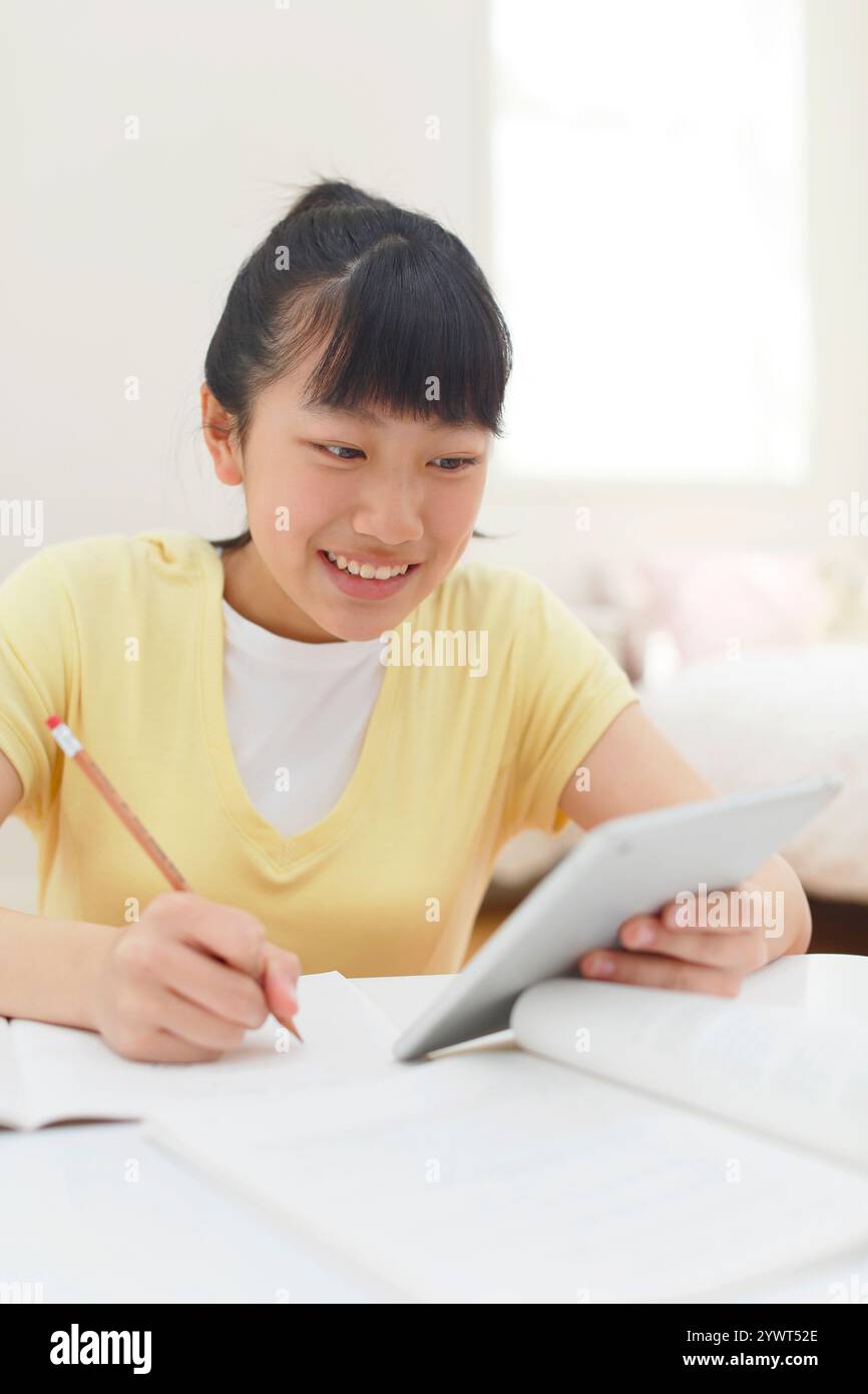 Girl studying in her room Stock Photo - Alamy
