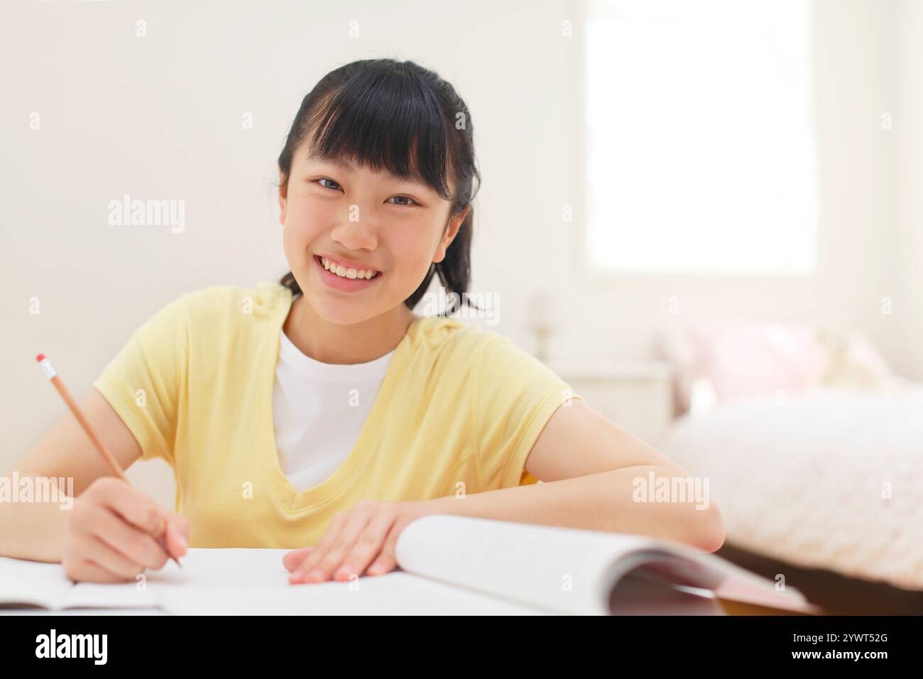 Girl studying in her room Stock Photo - Alamy