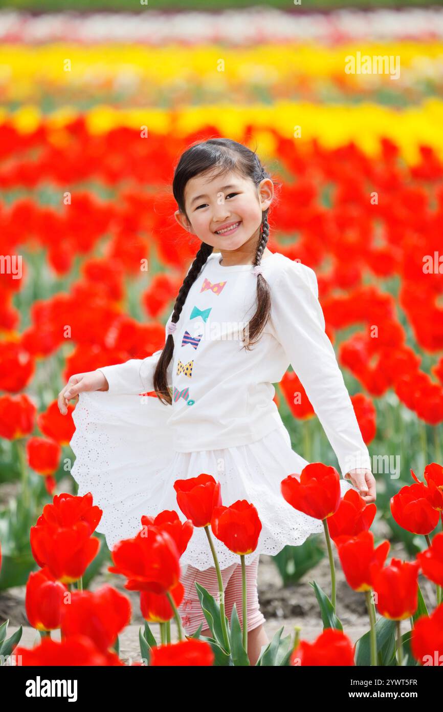 Girl laughing in tulip field Stock Photo - Alamy