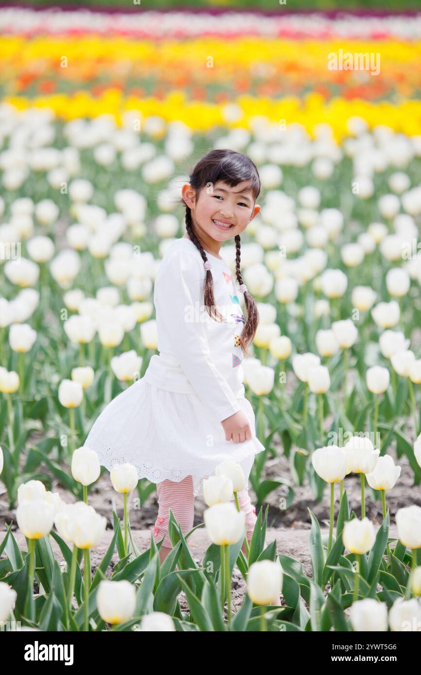 Girl laughing in tulip field Stock Photo - Alamy