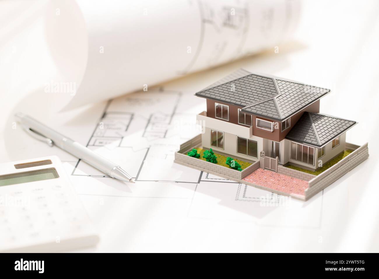 Miniature house and floor plan, calculator Stock Photo - Alamy