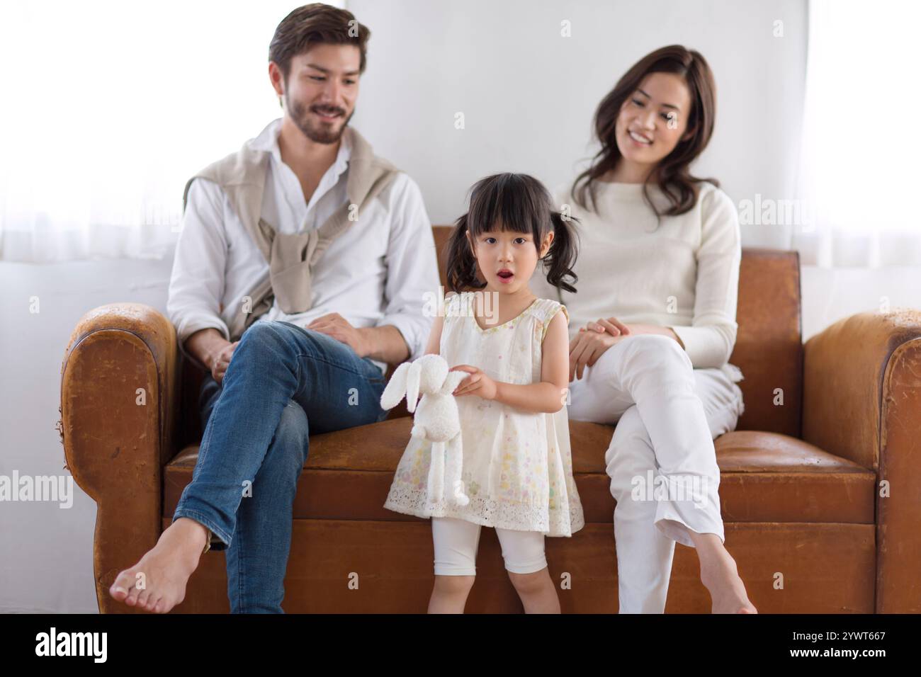 Parent and child relaxing in the living room Stock Photo - Alamy