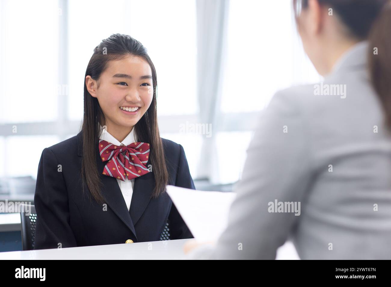 Female students being interviewed in a classroom Stock Photo - Alamy
