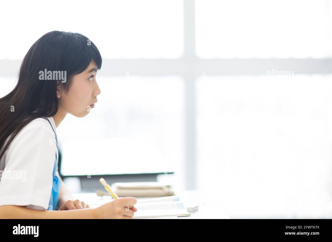 Female students taking a class Stock Photo - Alamy