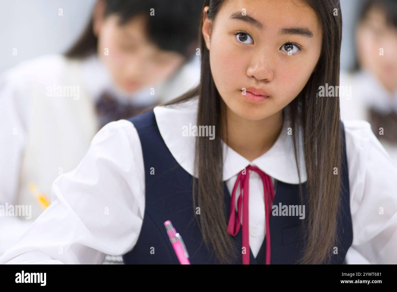 Female students taking a class Stock Photo - Alamy