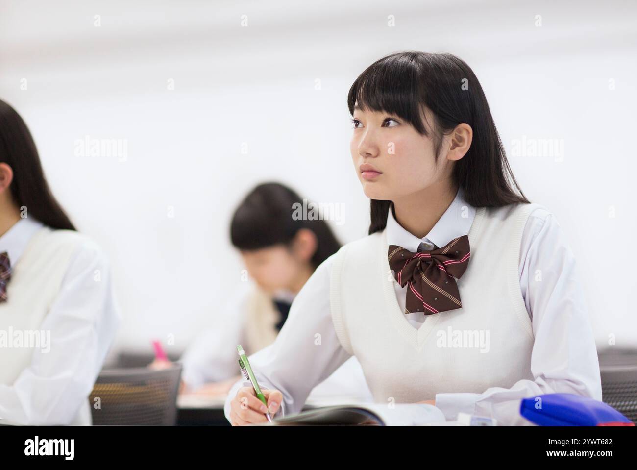Female students taking a class Stock Photo - Alamy