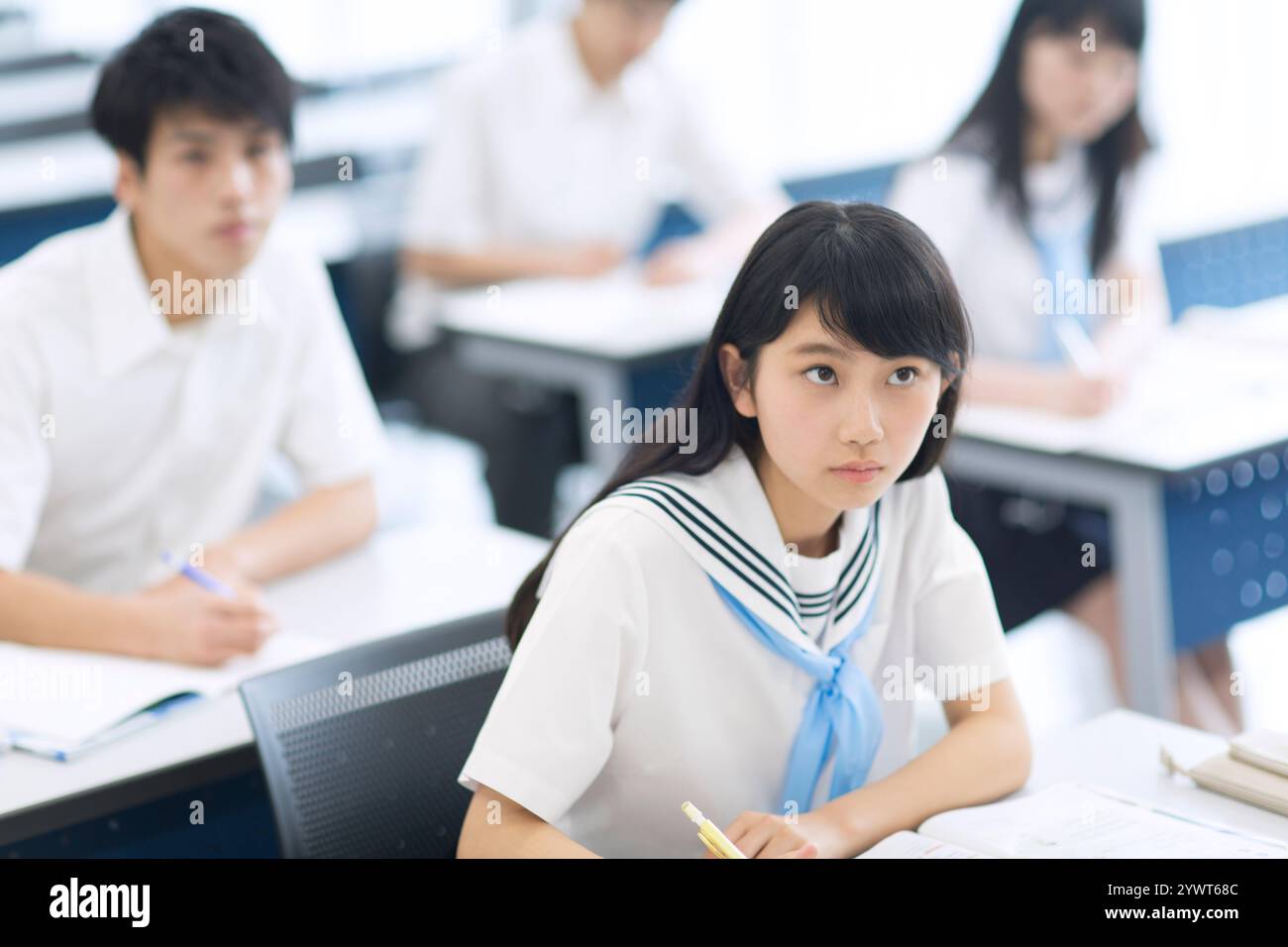 Female students taking a class Stock Photo - Alamy