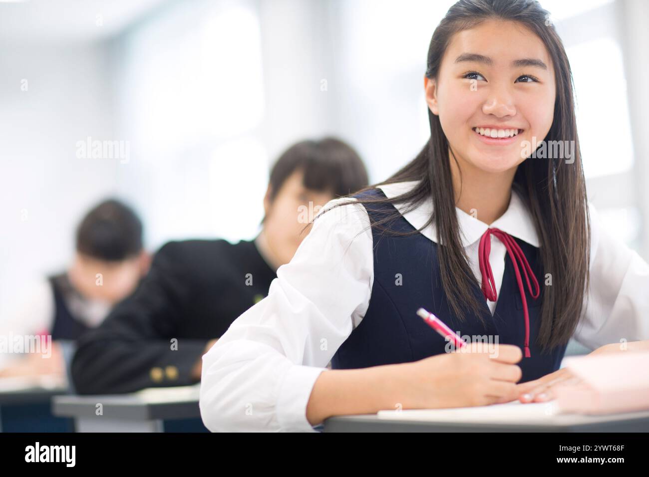 Female students taking a class Stock Photo - Alamy