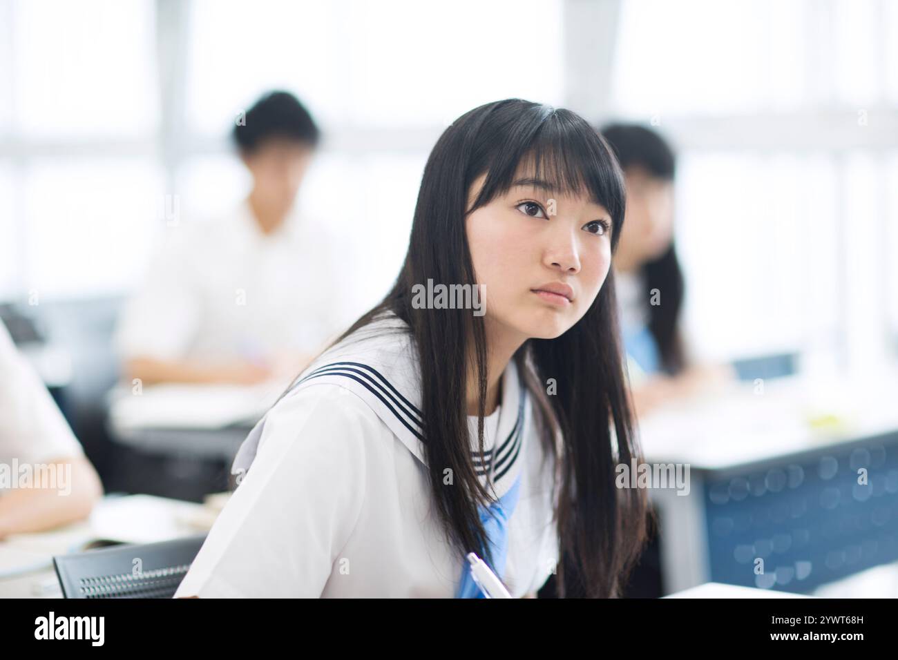 Female students taking a class Stock Photo - Alamy