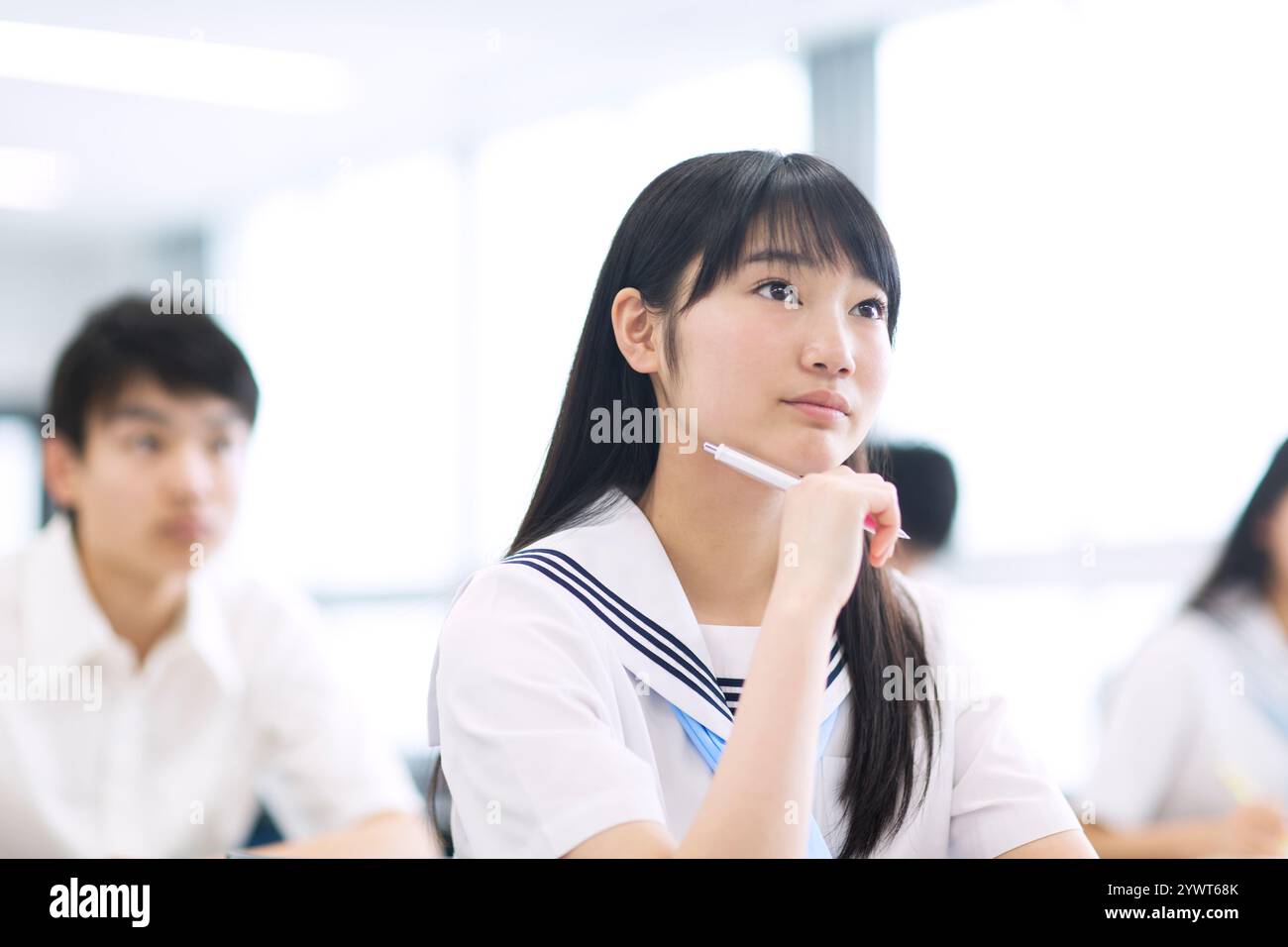 Female students taking a class Stock Photo - Alamy