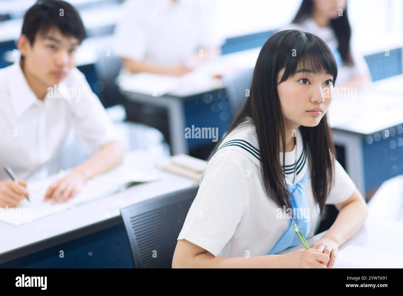 Female students taking a class Stock Photo - Alamy