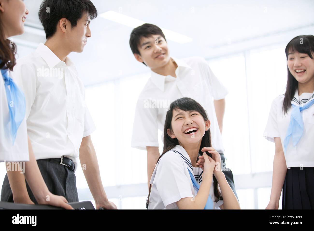 Students laughing in classroom Stock Photo - Alamy