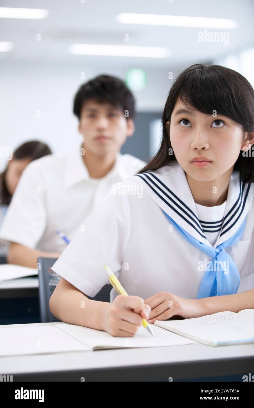 Female students taking a class Stock Photo - Alamy