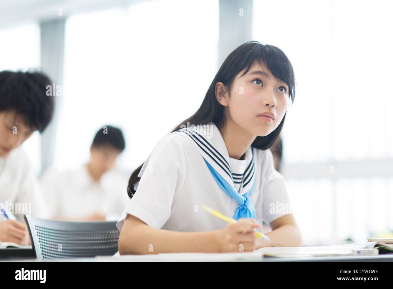 Female students taking a class Stock Photo - Alamy