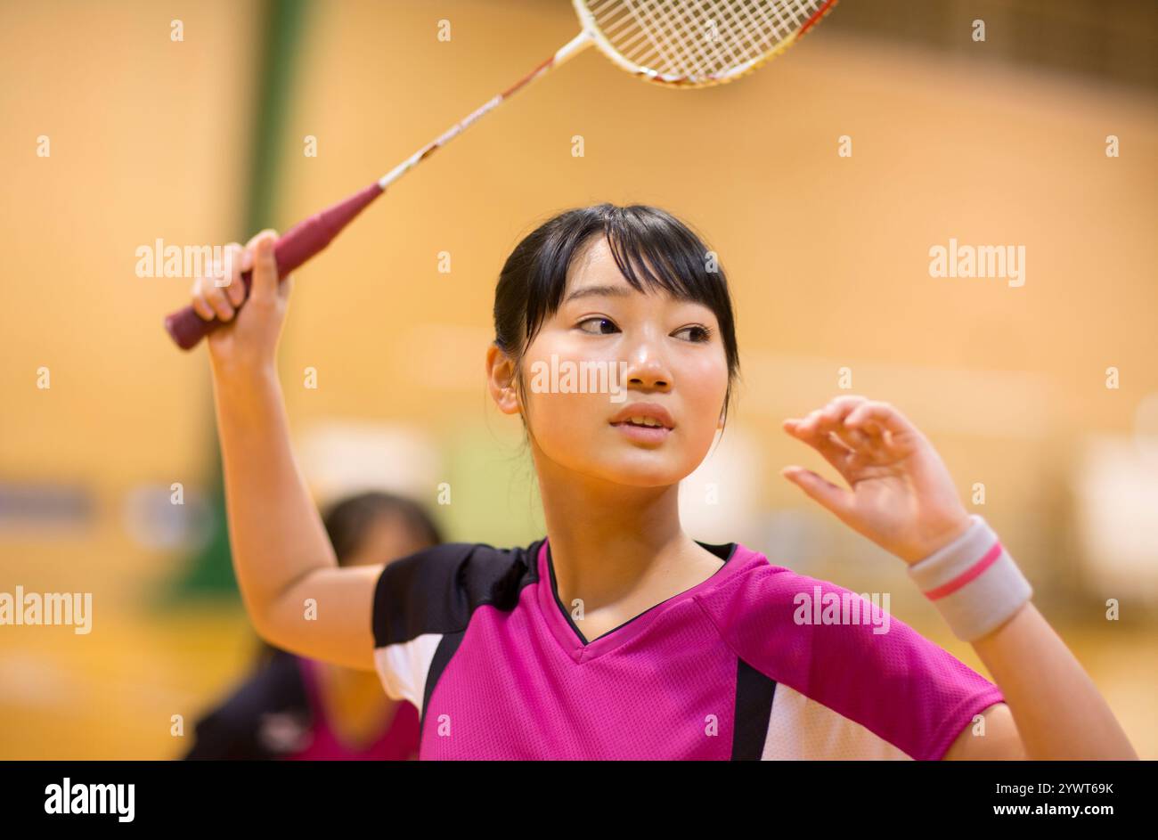 Female student playing badminton Stock Photo - Alamy