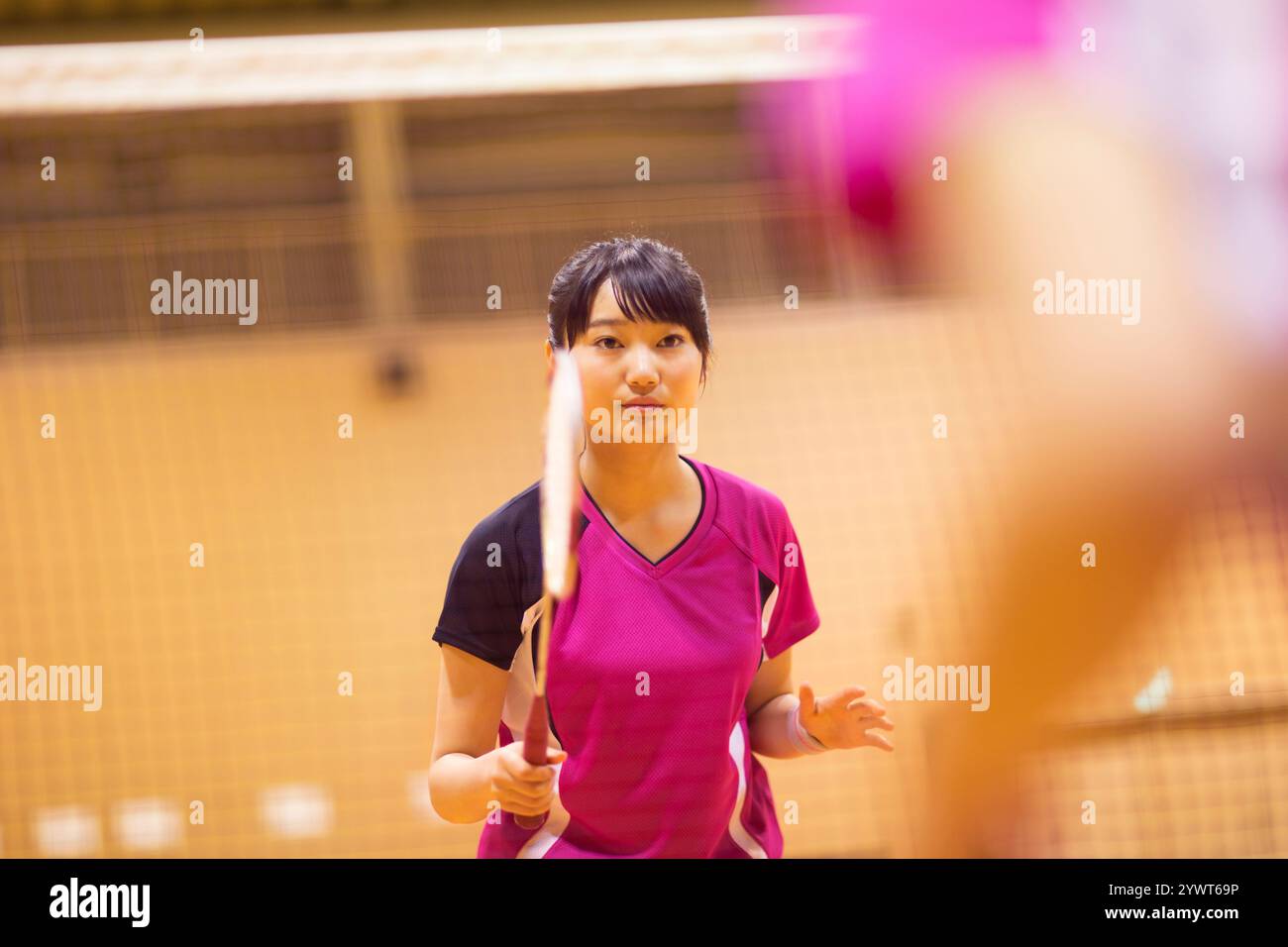 Female student playing badminton Stock Photo - Alamy