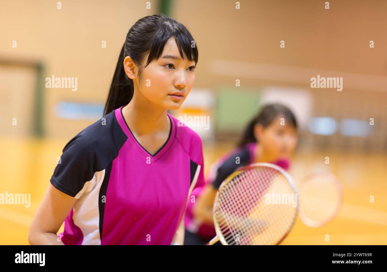 Female student playing badminton Stock Photo - Alamy