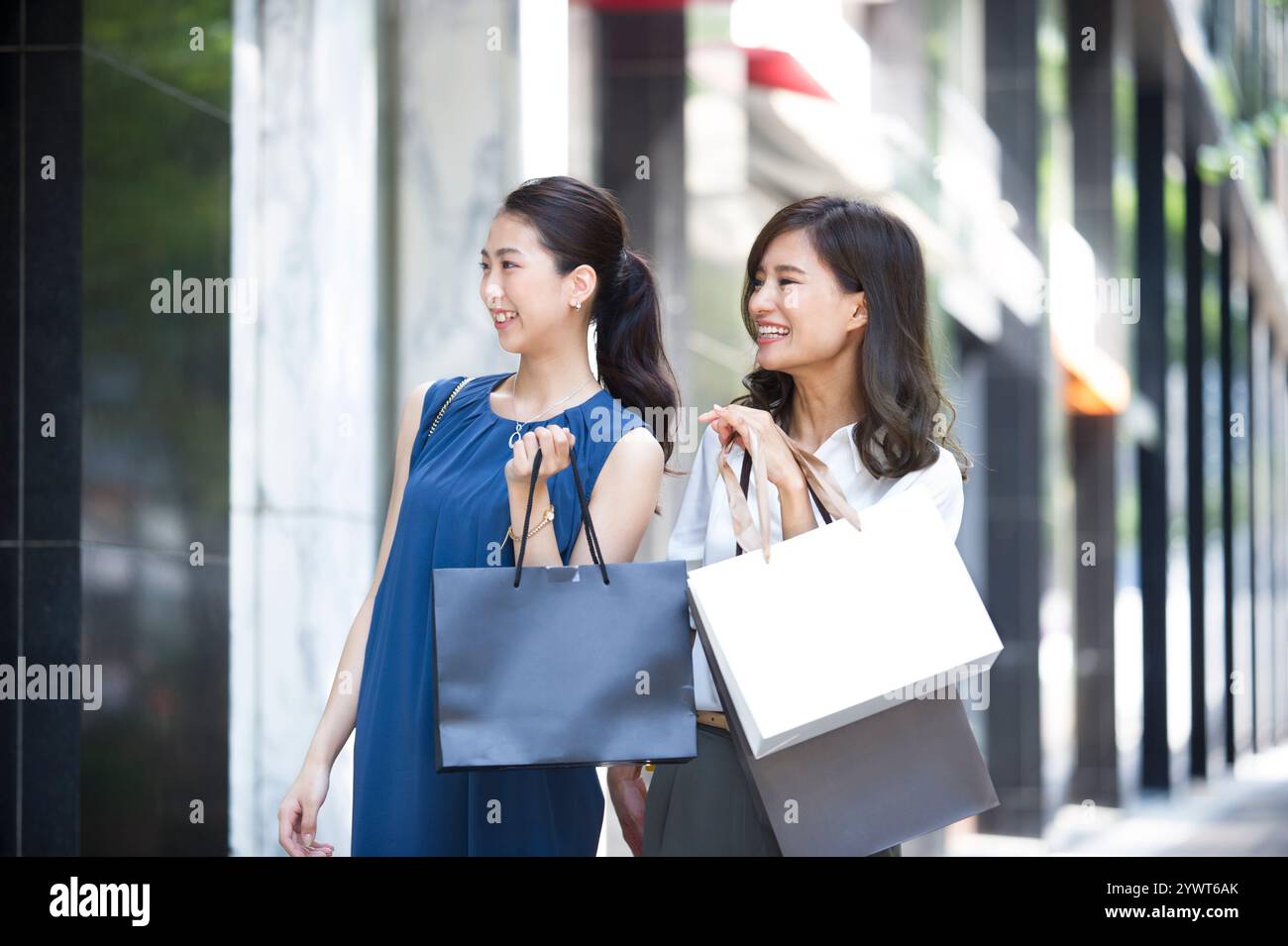 Two women window shopping Stock Photo - Alamy