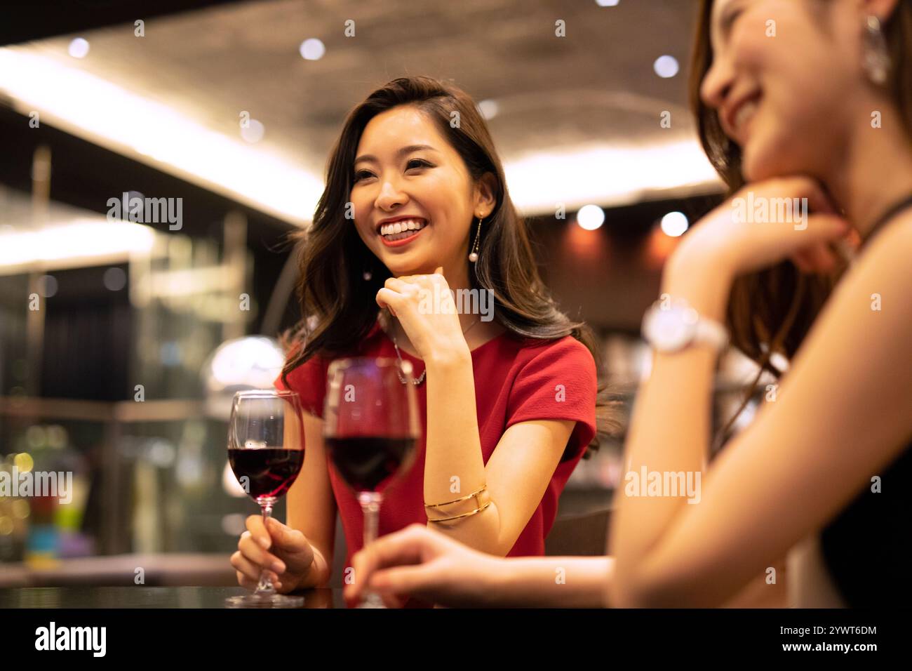 Woman talking while drinking alcohol Stock Photo - Alamy