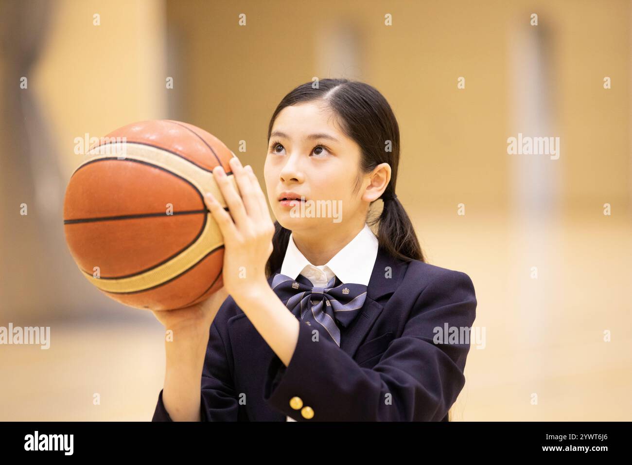 Female high school student holding a basketball Stock Photo - Alamy