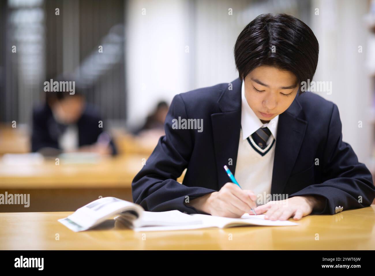 High school boy studying Stock Photo - Alamy