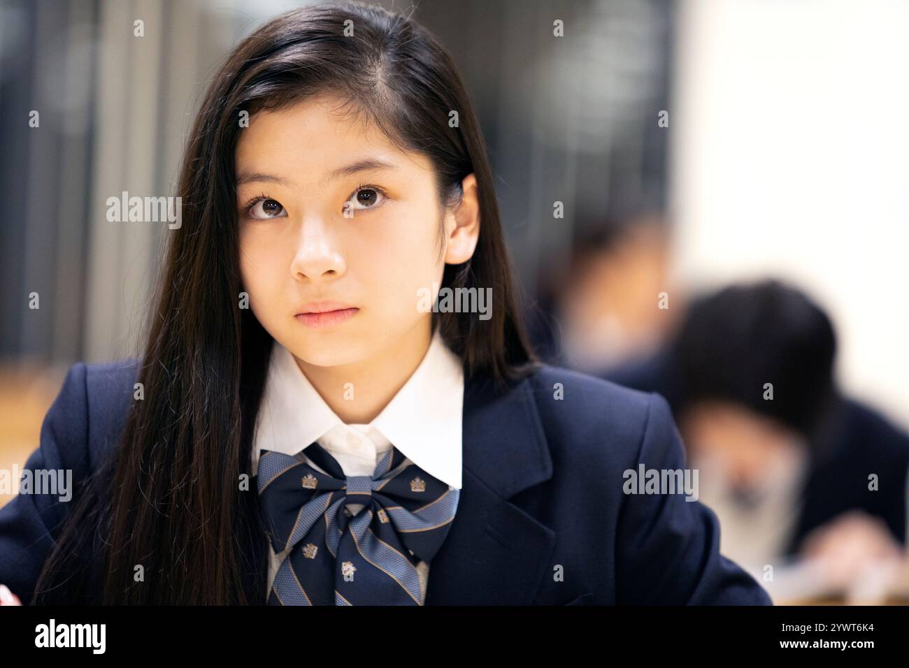 Female high school student looking up while studying Stock Photo - Alamy