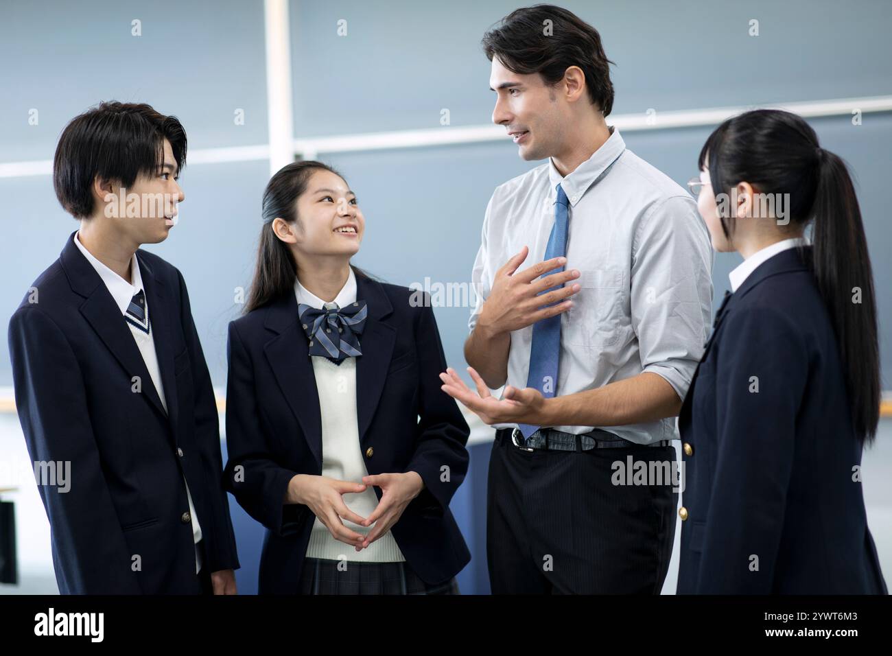 High school students talking with a foreign teacher Stock Photo - Alamy