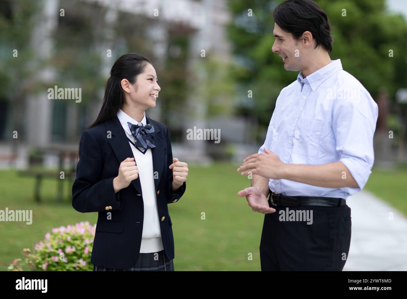 High school girl talking with a foreigner Stock Photo - Alamy
