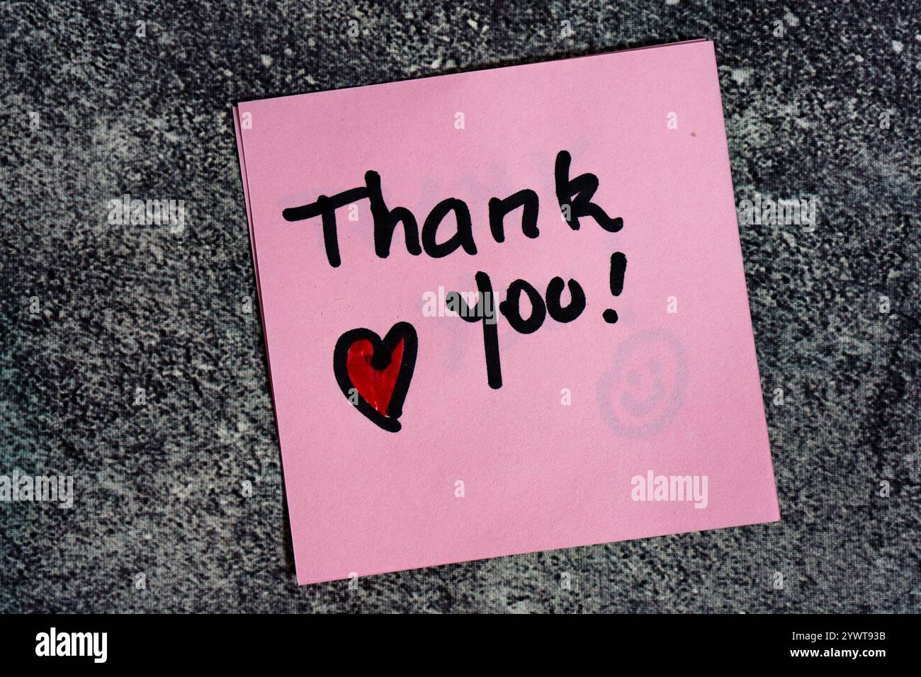 Thank you words written on a post-it or note Stock Photo - Alamy